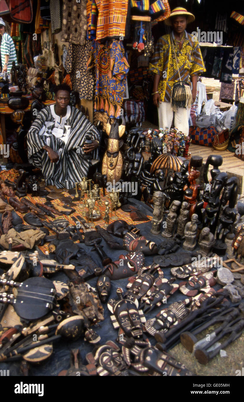 A craft merchant selling woodcarvings at the Arts Center and craft ...