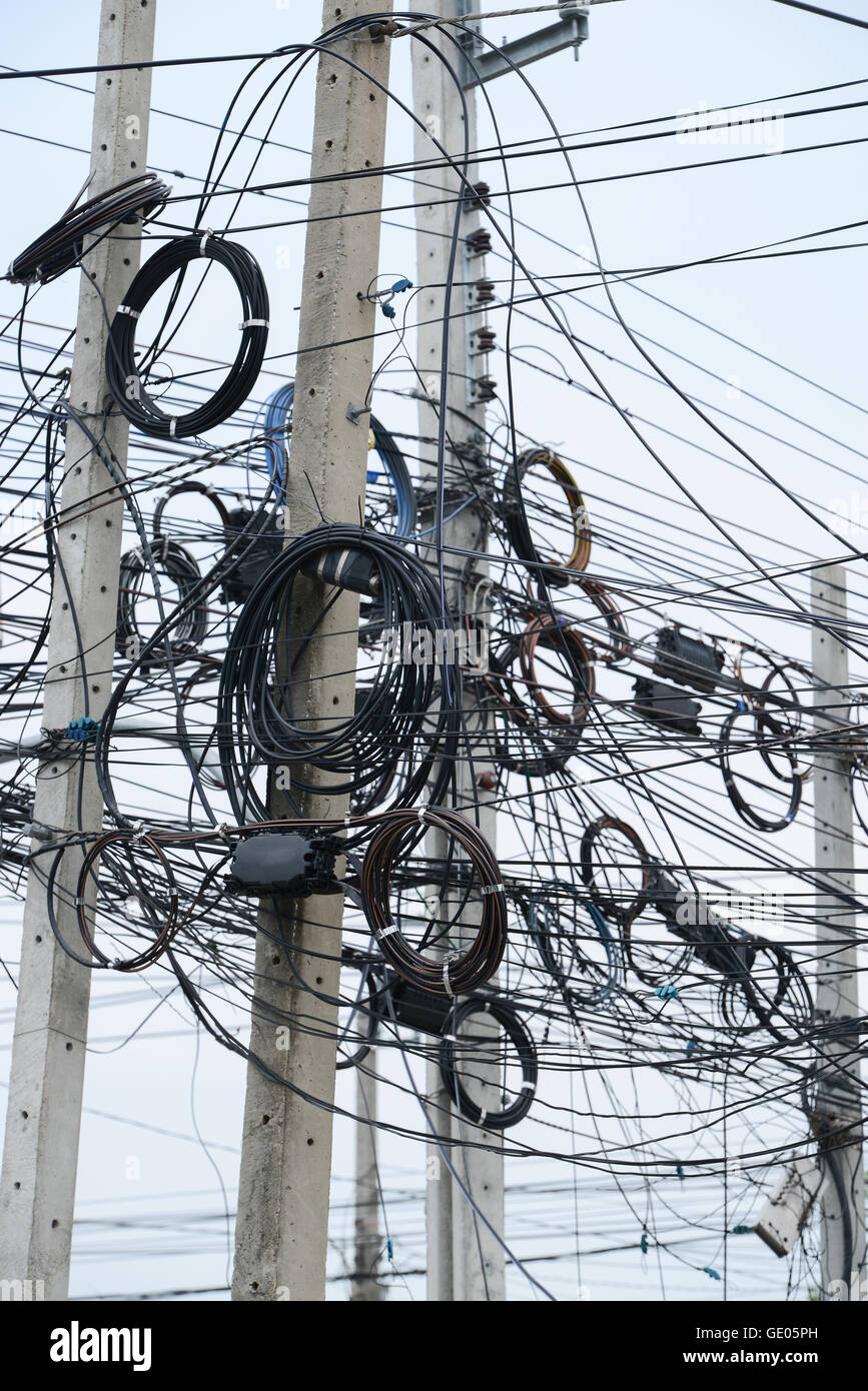 Mess of electric cables and telephone wires hi-res stock photography ...