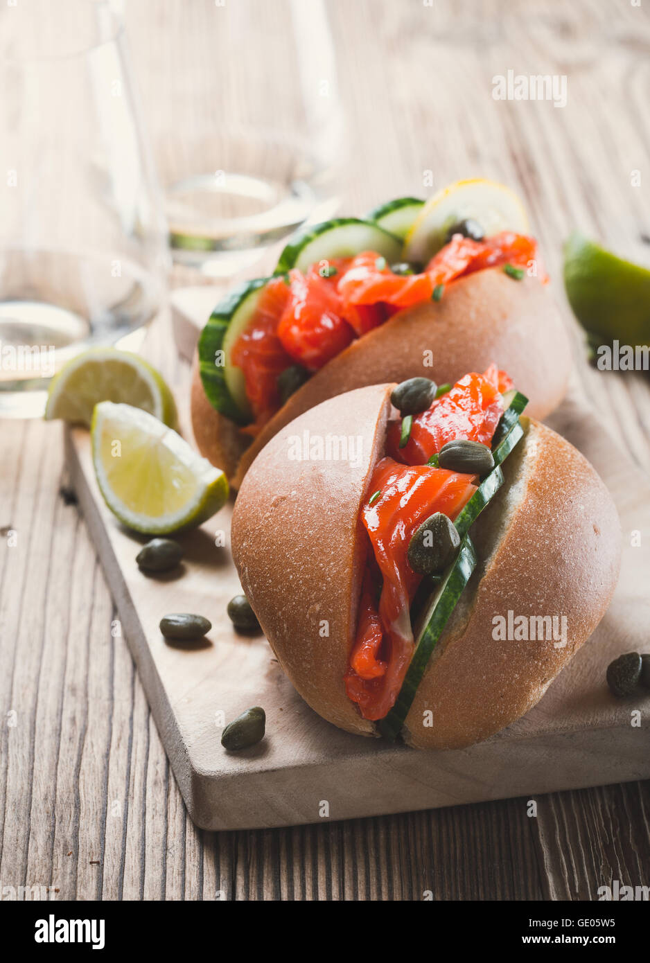 Smoked salmon bun sandwich with cucumber and capers Stock Photo - Alamy