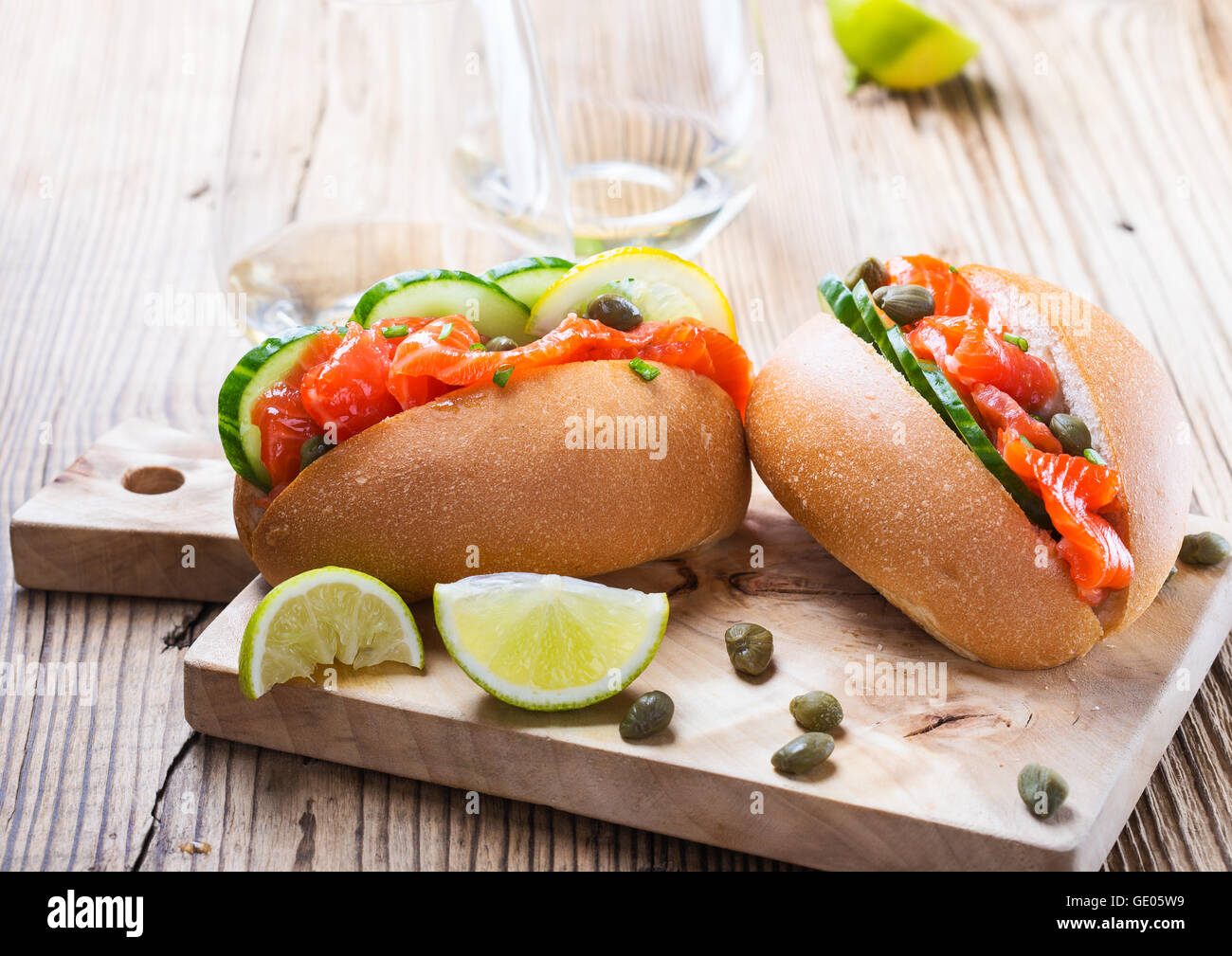 Smoked salmon bun sandwich with cucumber and capers Stock Photo - Alamy