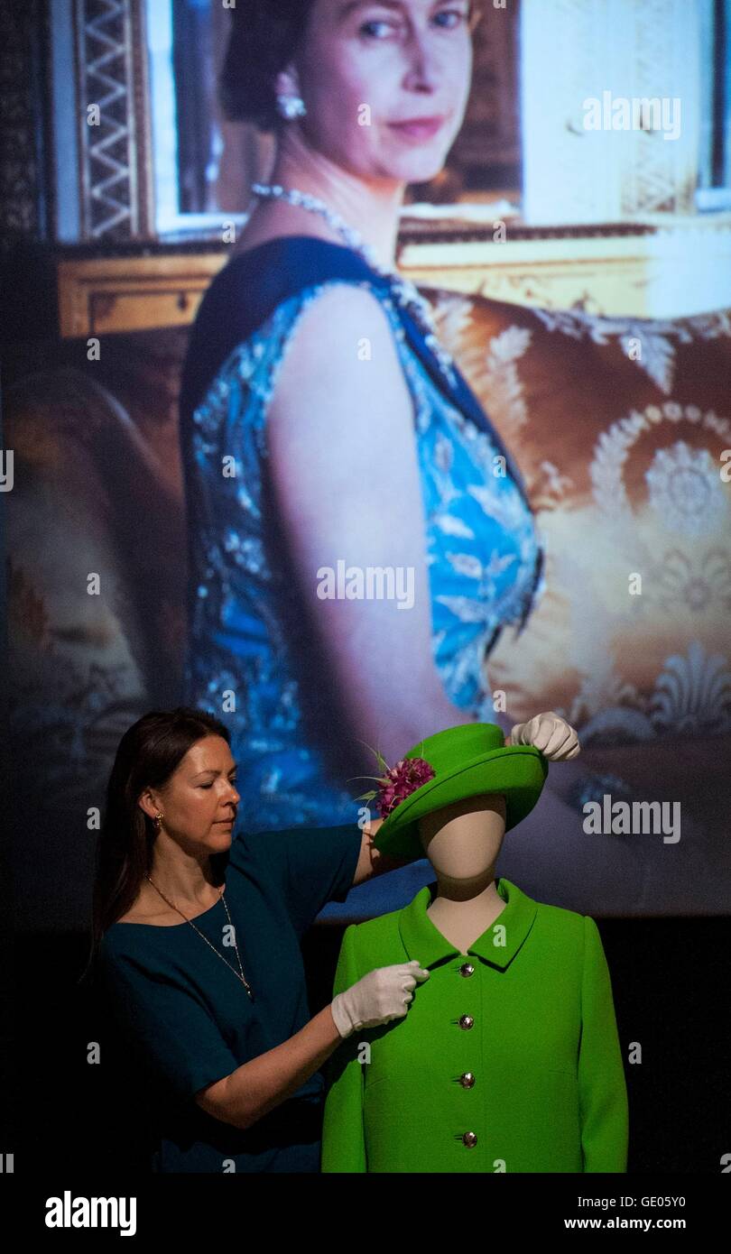 Curator Caroline de Guitaut adjusts an outfit by Stewart Parvin ...