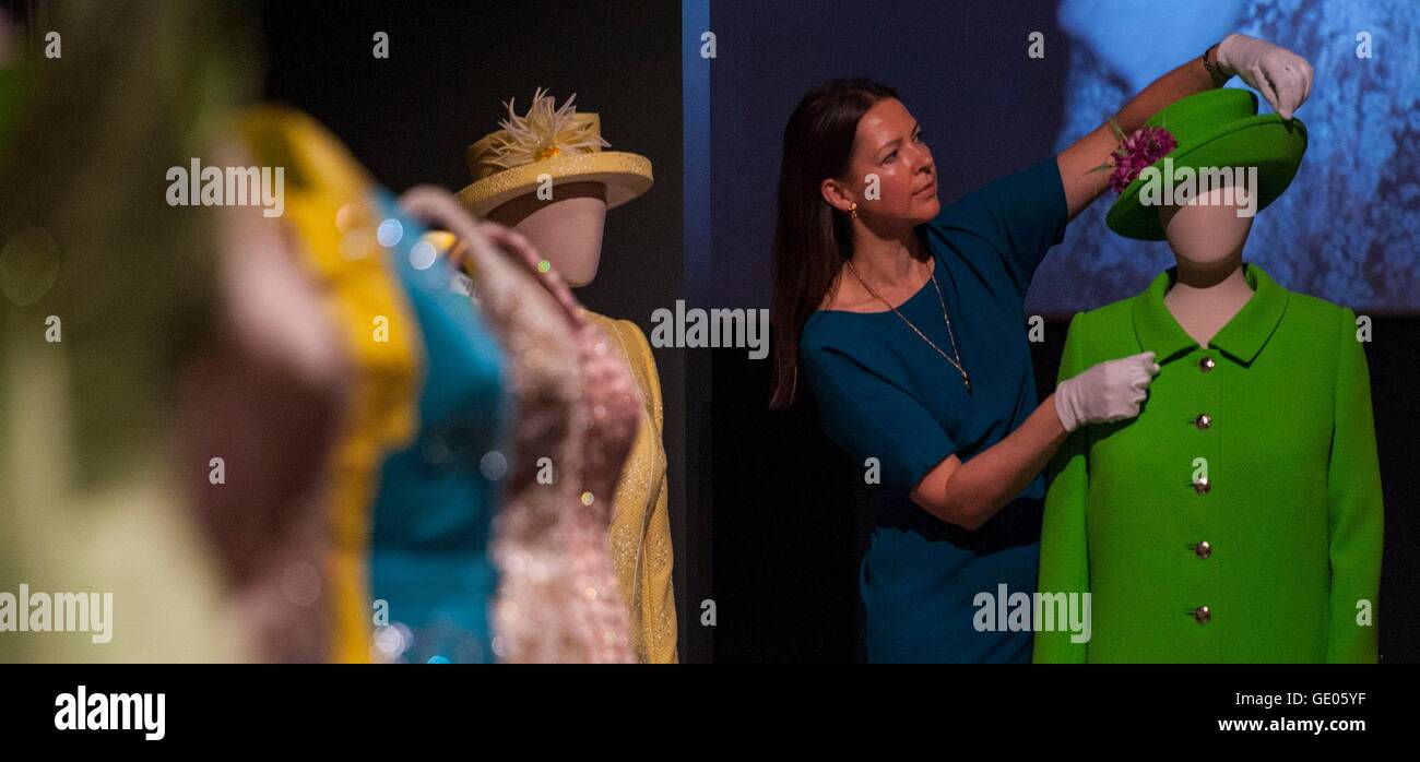 Curator Caroline de Guitaut adjusts an outfit by Stewart Parvin ...
