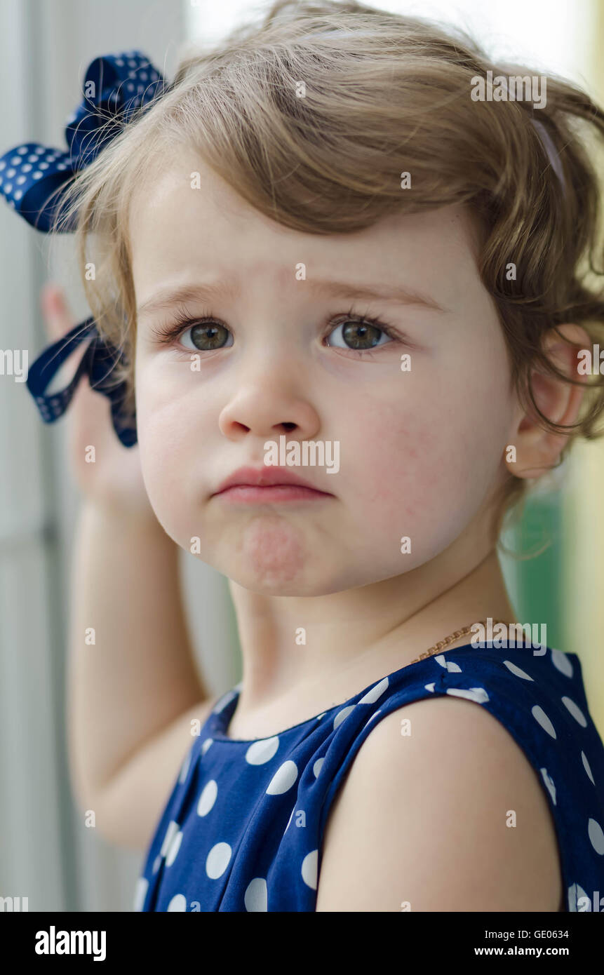 Portrait of a little girl baby at the window Stock Photo - Alamy