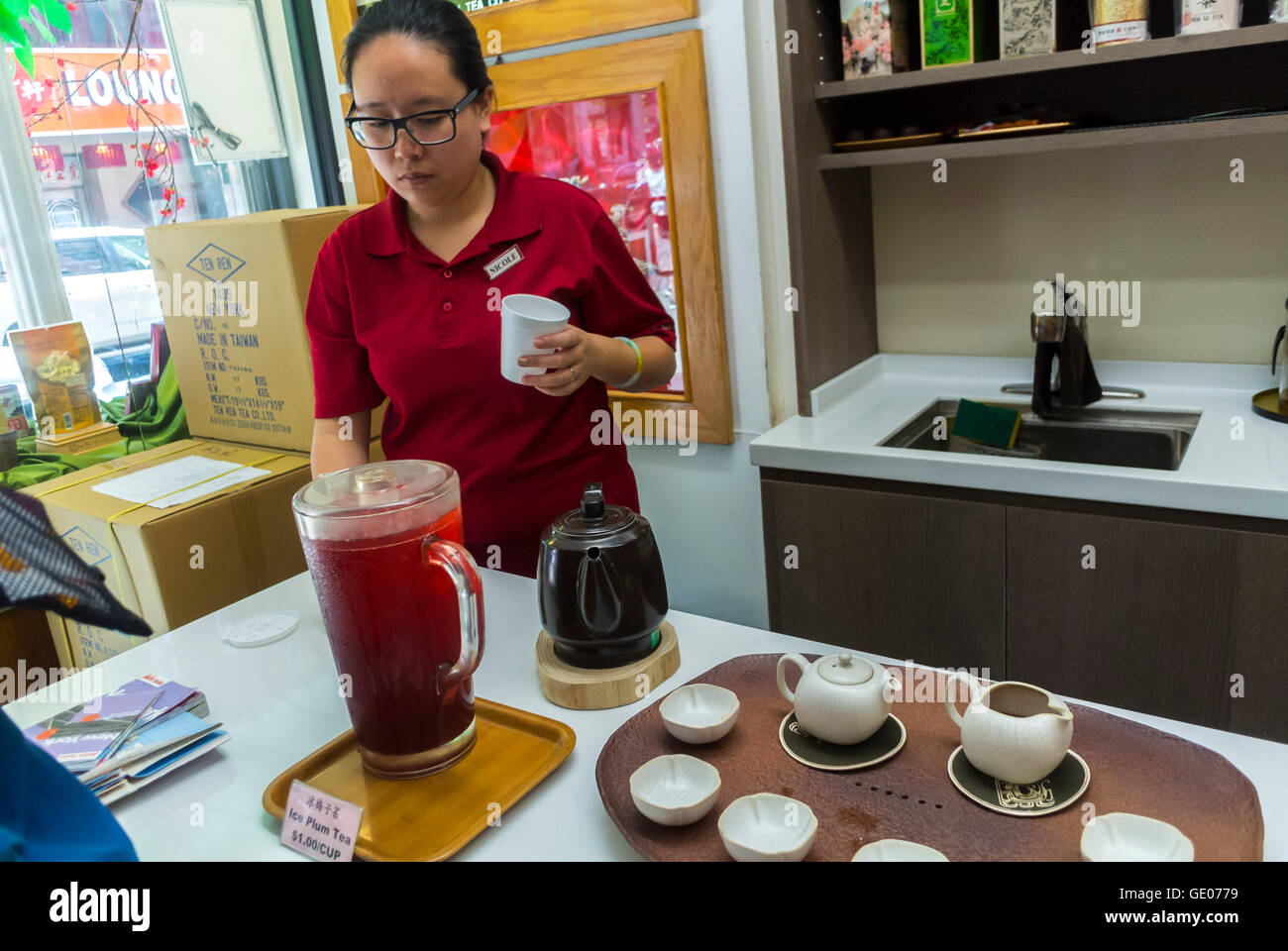 New York City, NY, USA, Chinese Woman Serving Chinese Tea in ...