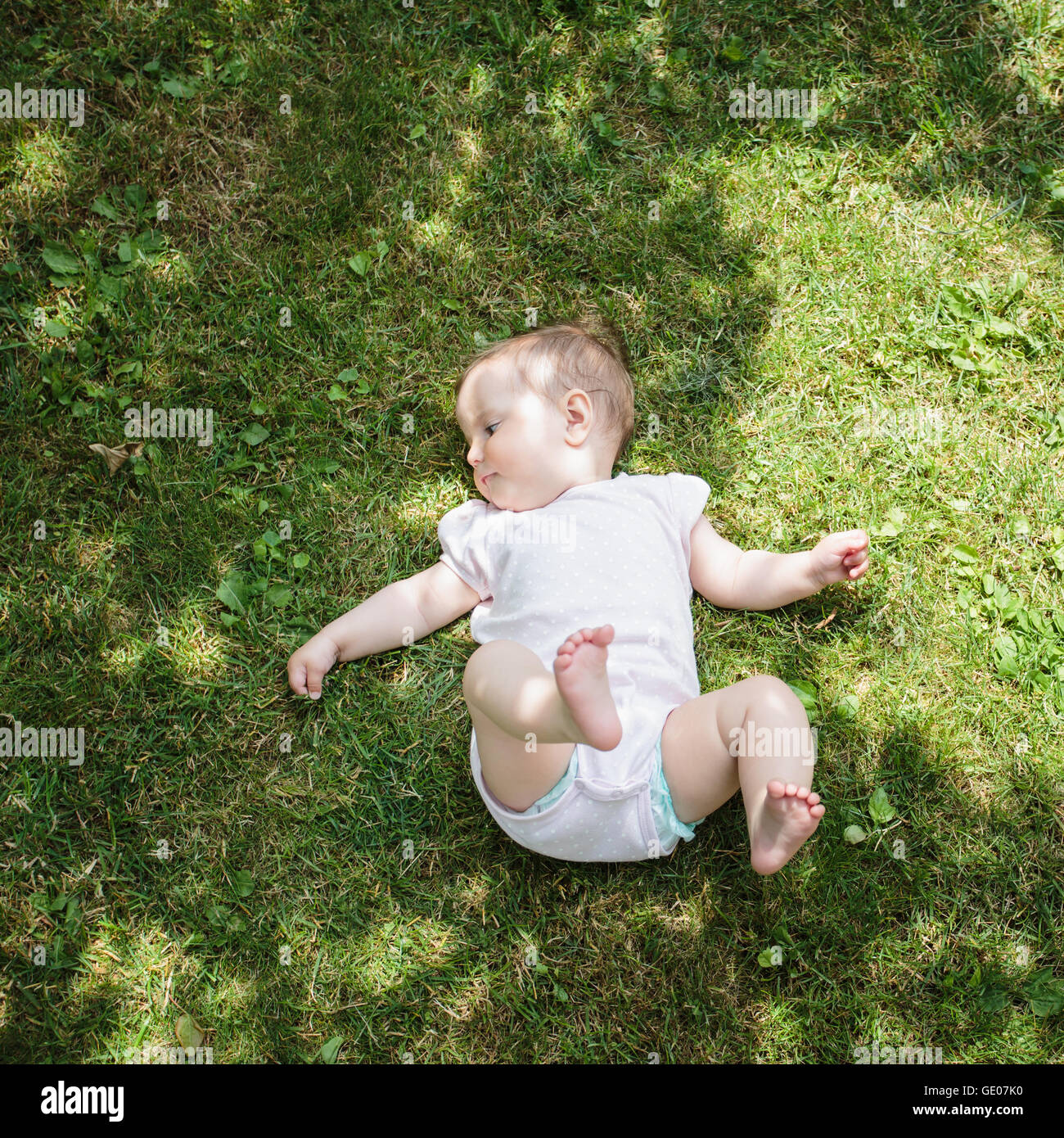 Baby is lying in the grass hi-res stock photography and images - Alamy