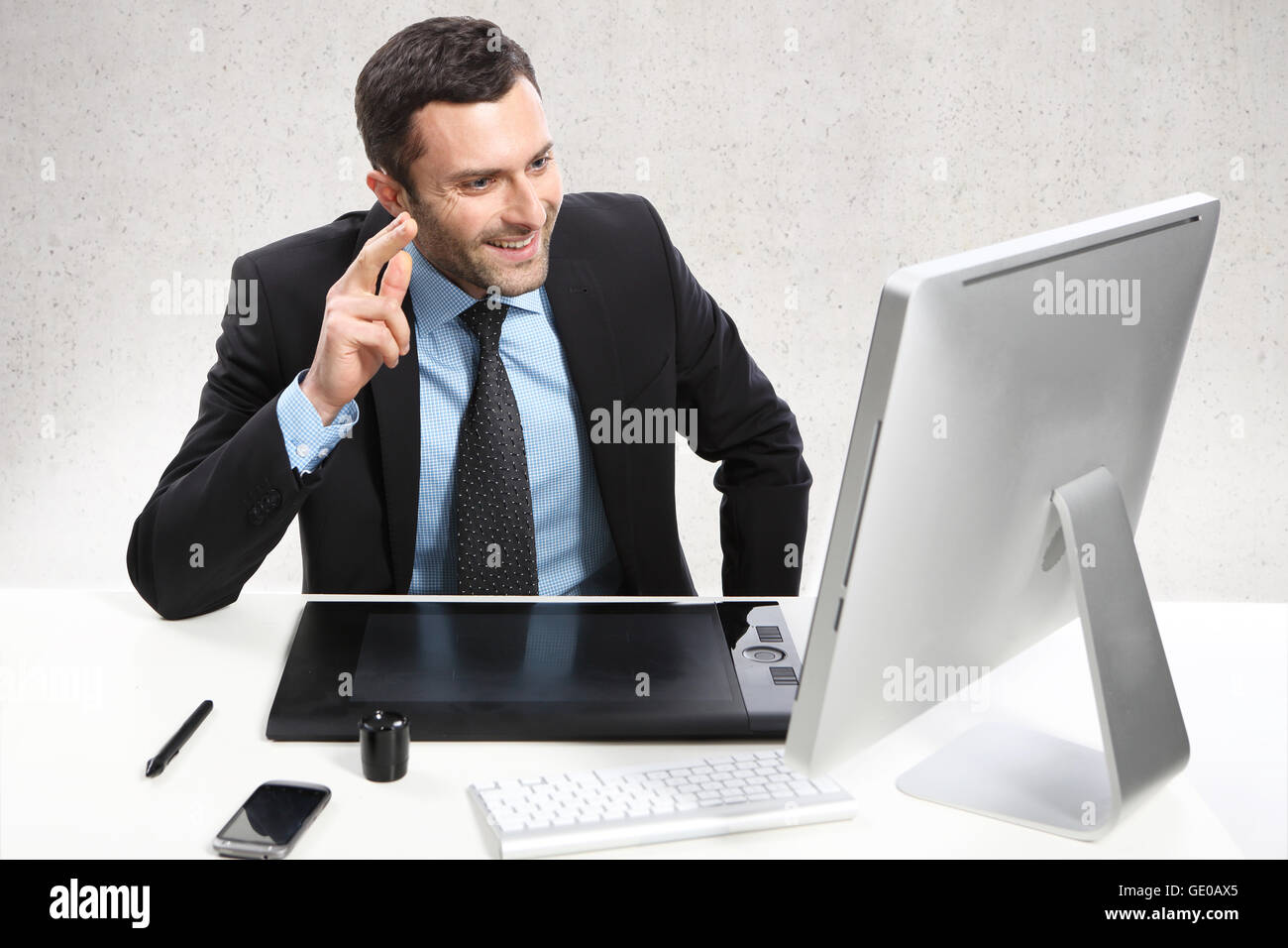 Business man working on a computer Stock Photo - Alamy