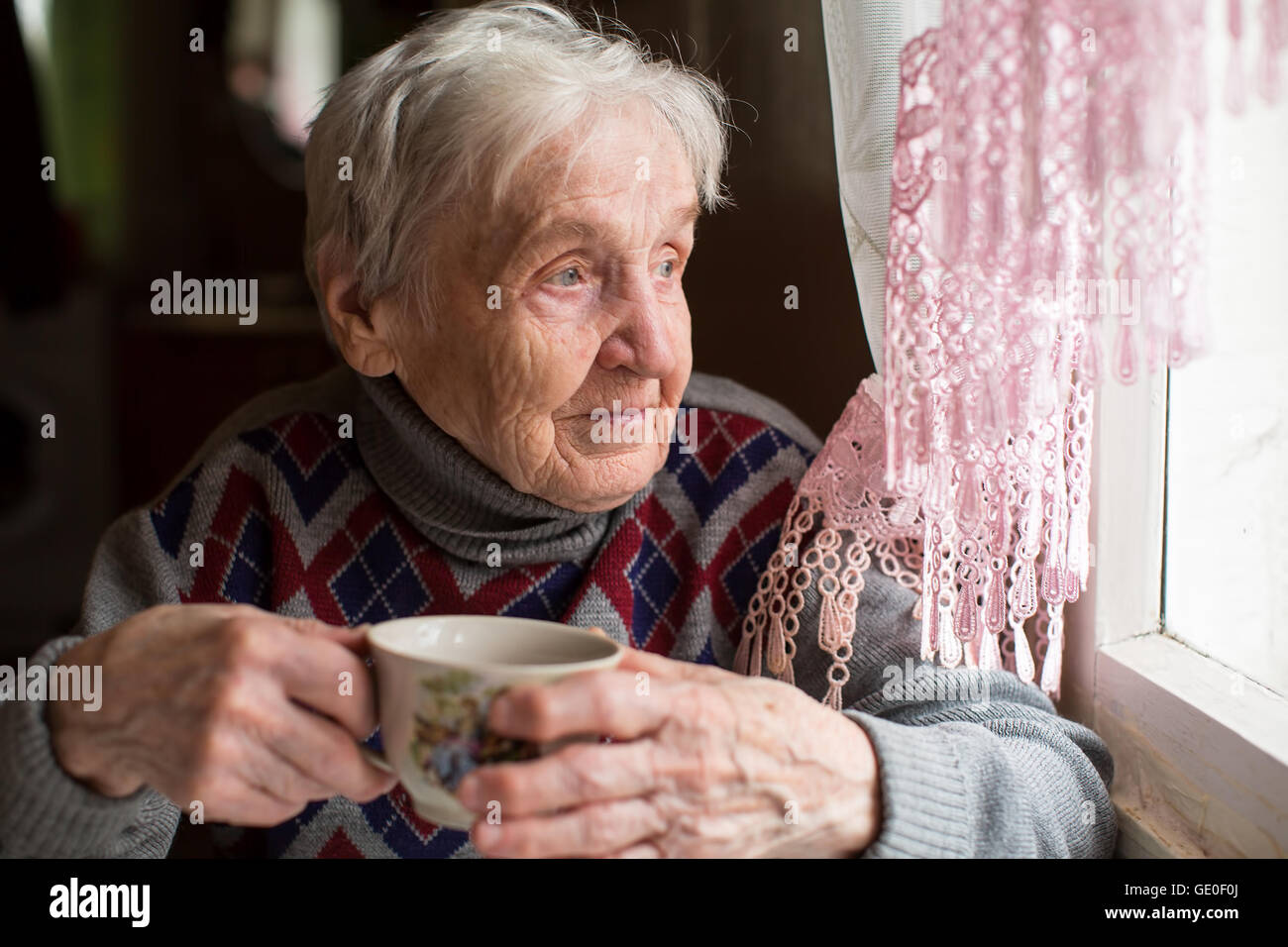 Sad mature woman drinking hi-res stock photography and images - Alamy