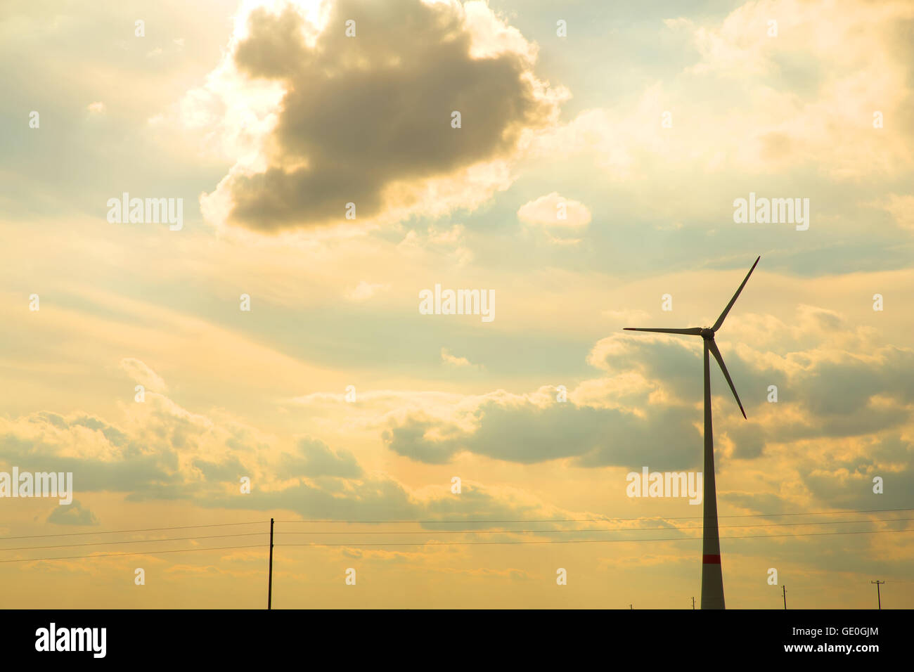 Wind turbine under a dramatic sky Stock Photo - Alamy