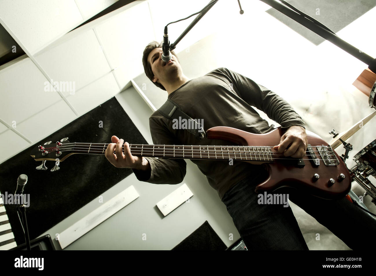 Black and white Portrait of a Rock singer playing bass in the rehearsal ...