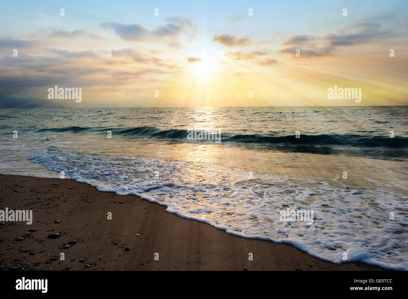 Ocean sunset rays is an ethereal ocean scenic with sun beams bursting ...