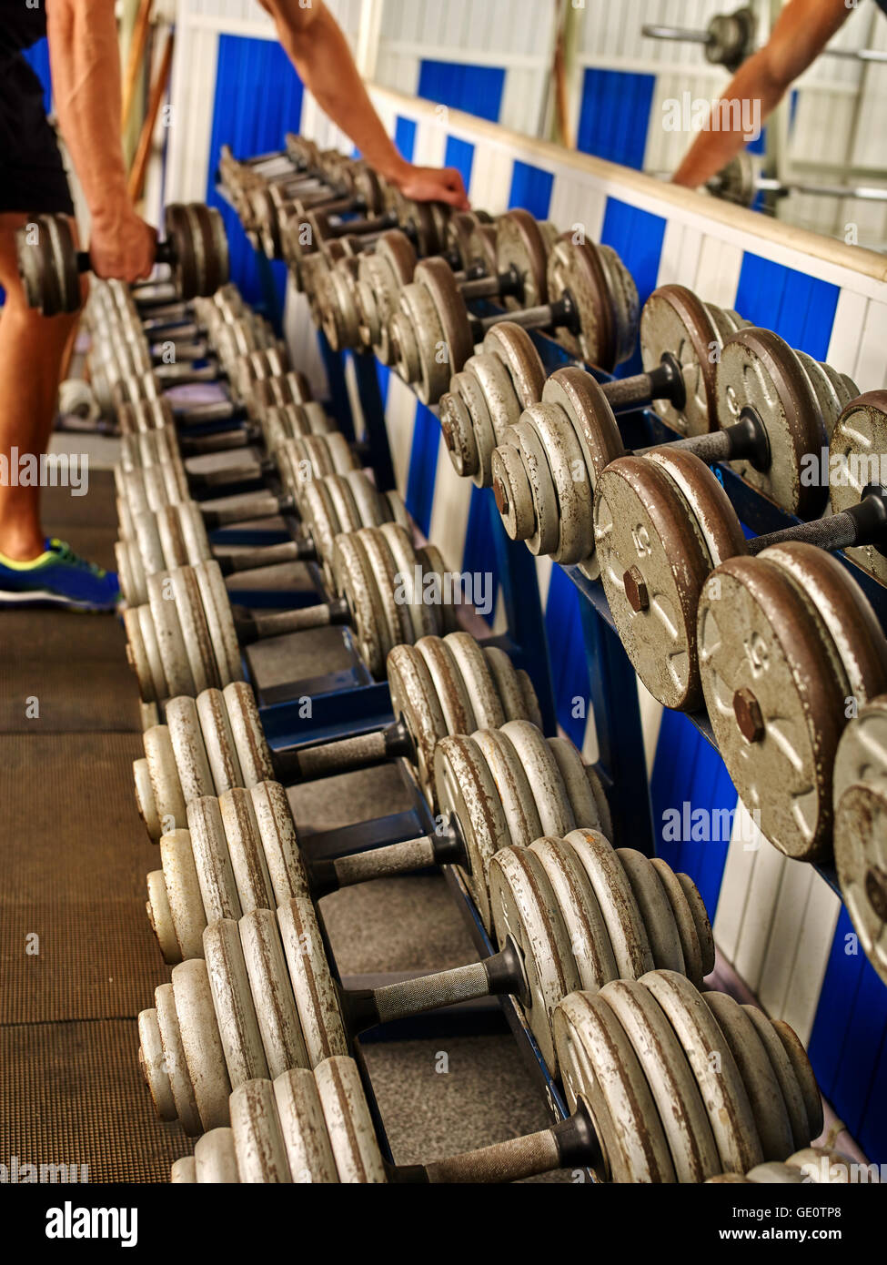 Dumbbells in sport gym Stock Photo - Alamy