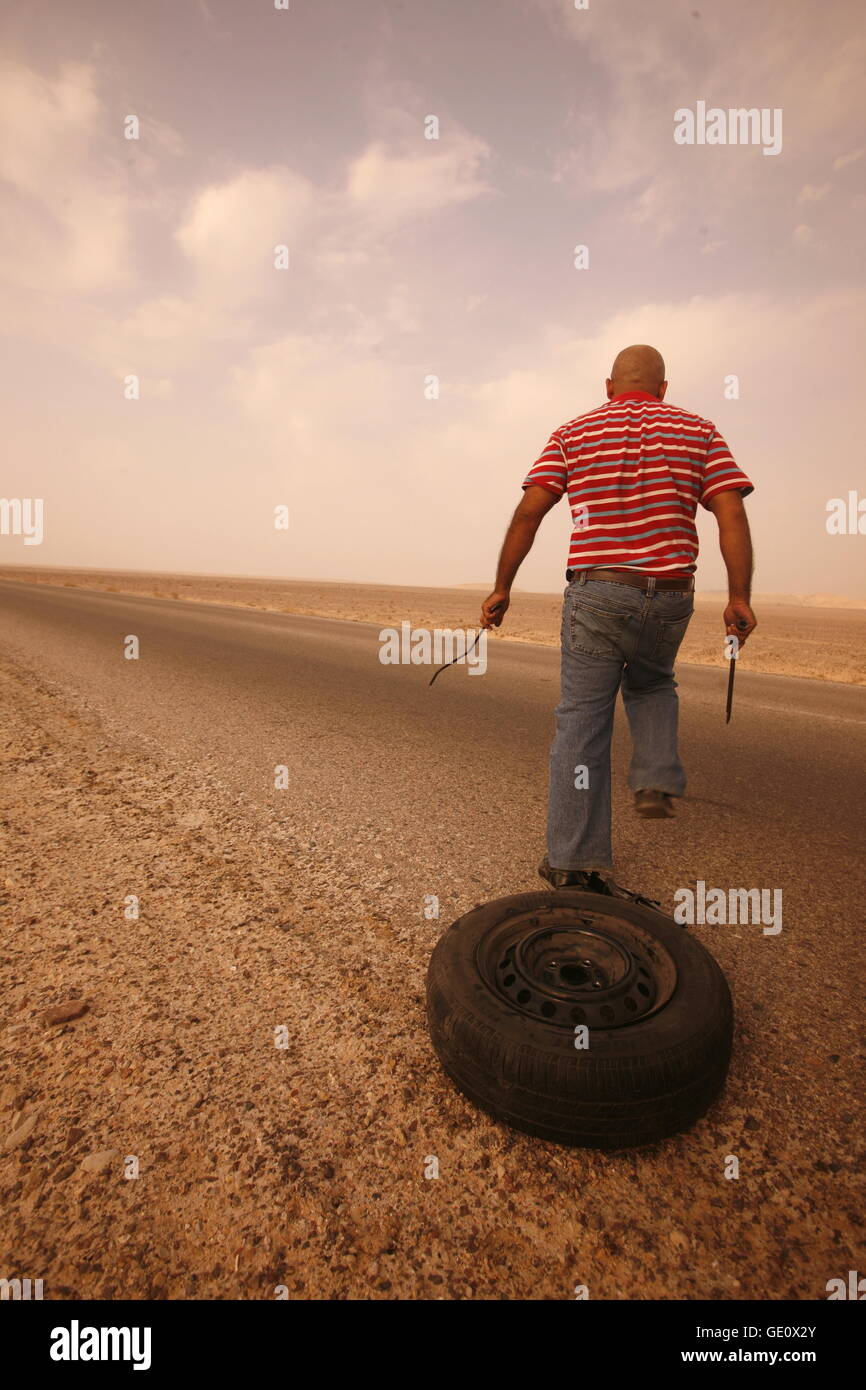 A flat tire on a Taxi on the Desertroad 65 near the Towns Safi and ...