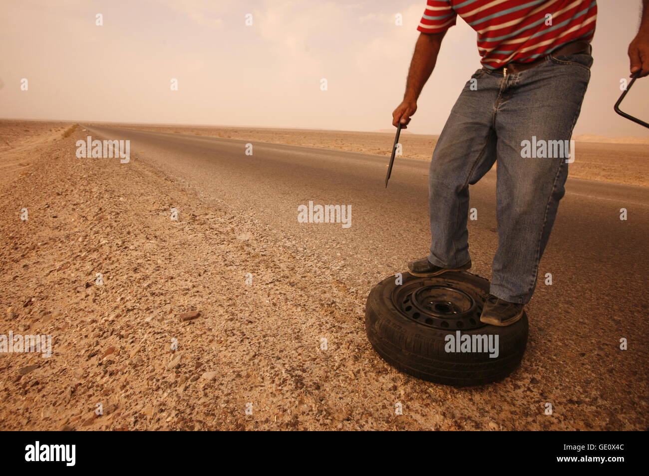 A flat tire on a Taxi on the Desertroad 65 near the Towns Safi and ...