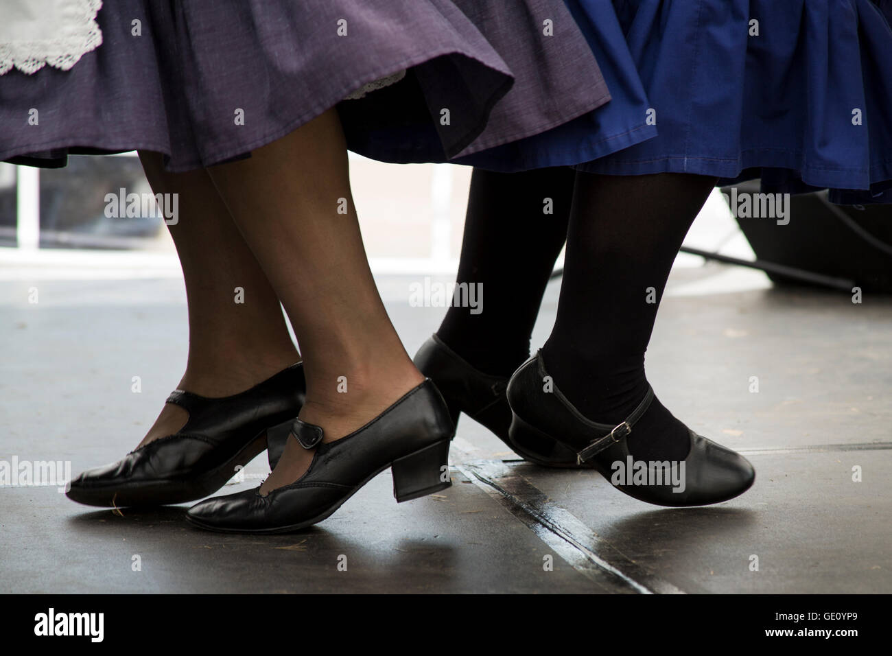 Two women perform a clog dance in traditional clothing Stock Photo - Alamy