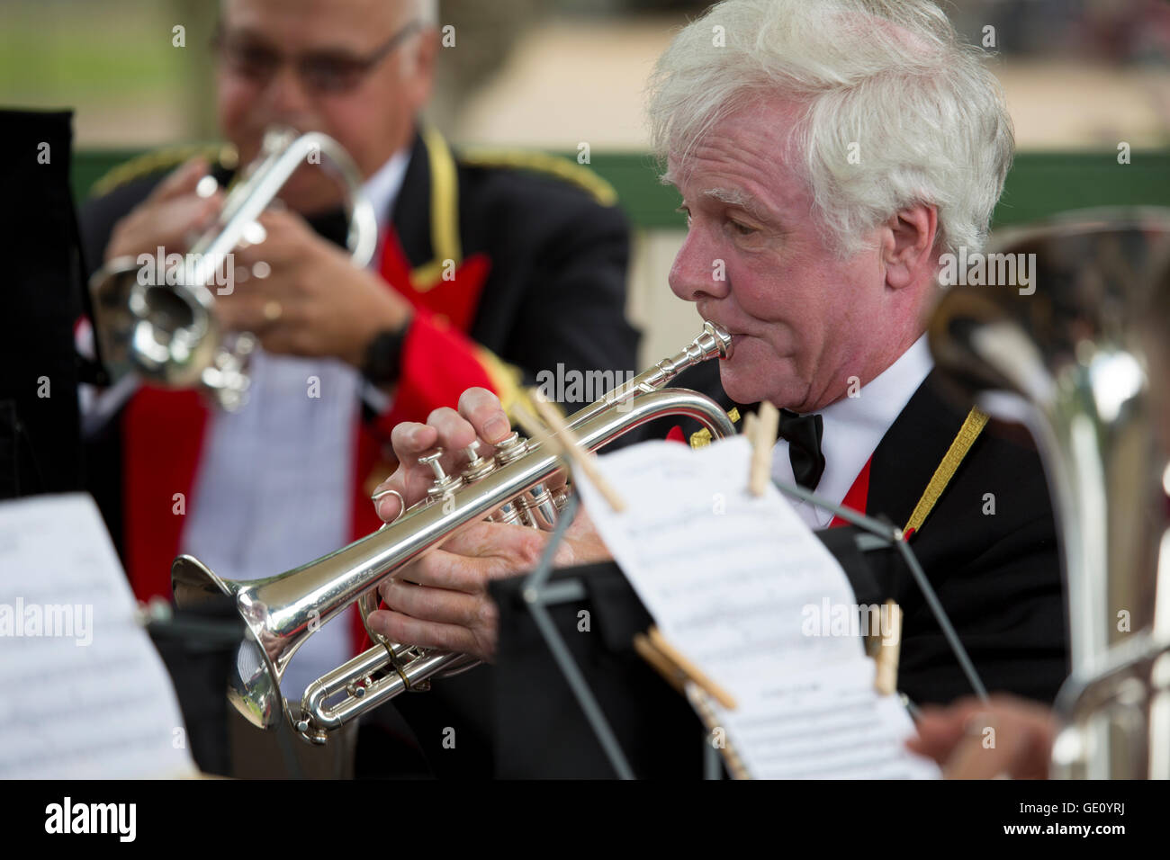 Two men play trumpets in a brass band Stock Photo - Alamy