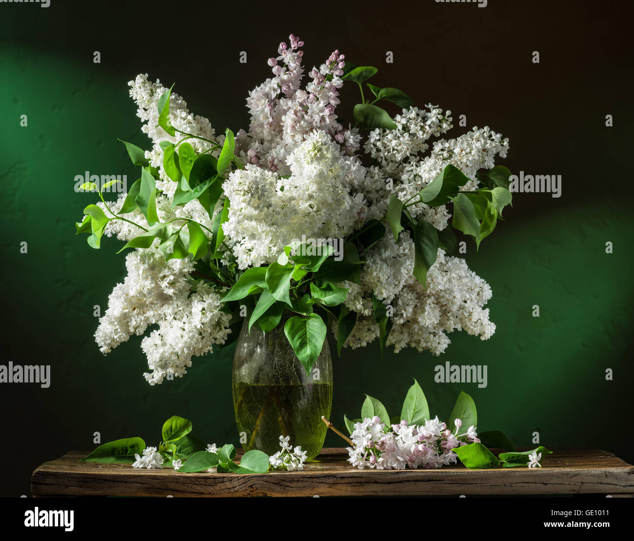 Lilac bouquet on the wooden table Stock Photo - Alamy