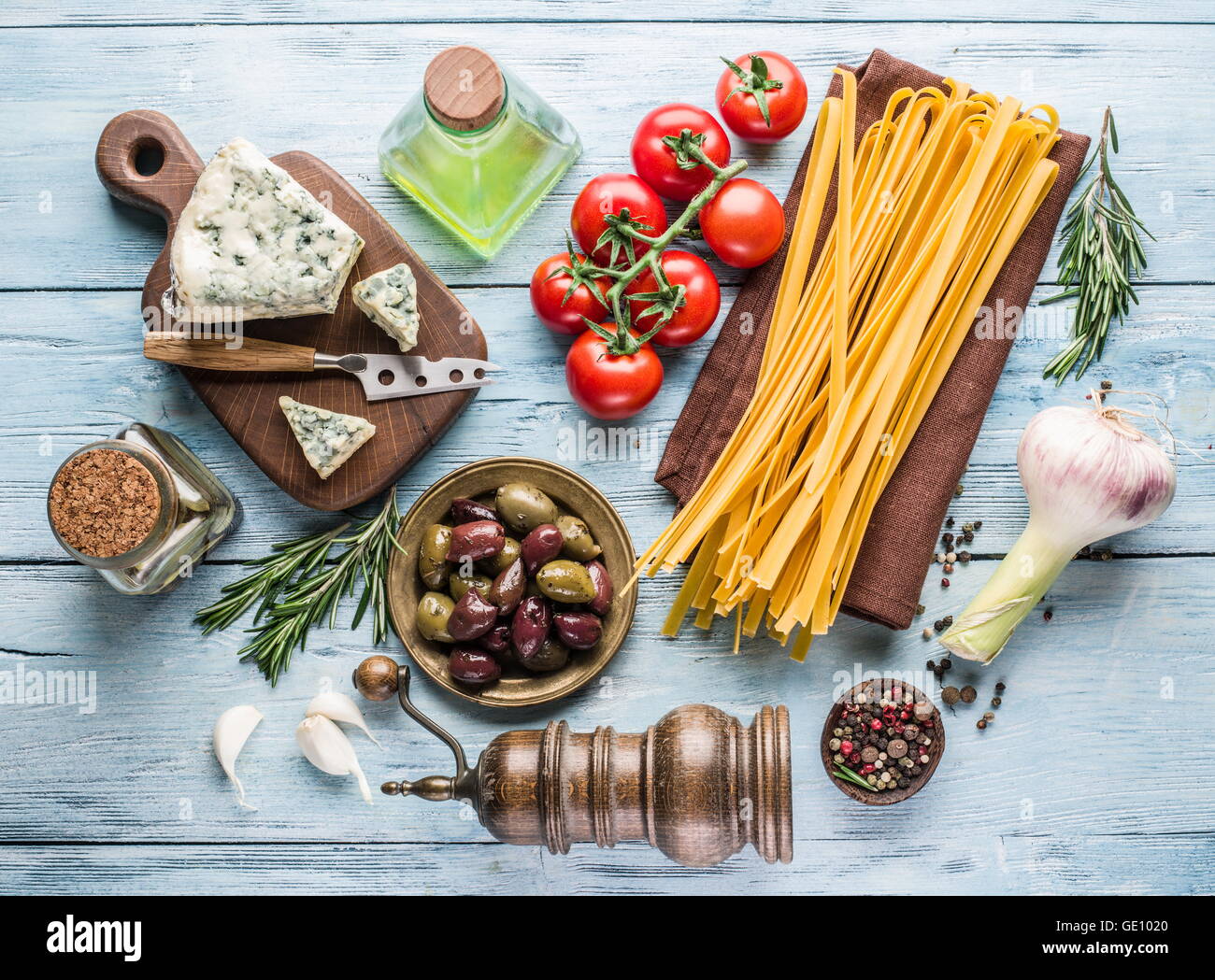 Pasta ingredients. Cherry-tomatoes, spaghetti pasta, rosemary and ...