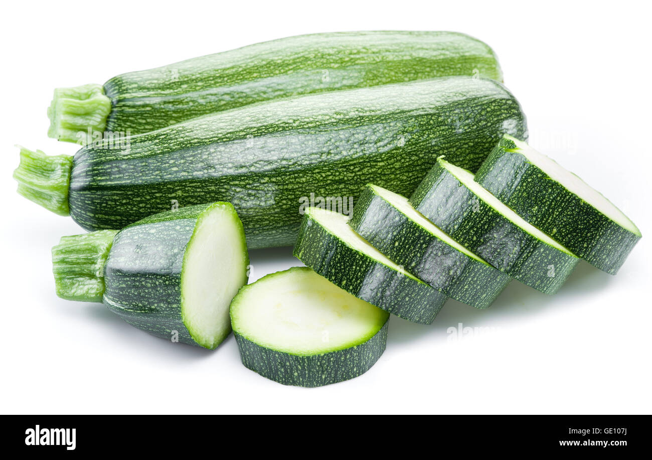 Zucchini with slices on a white background Stock Photo - Alamy