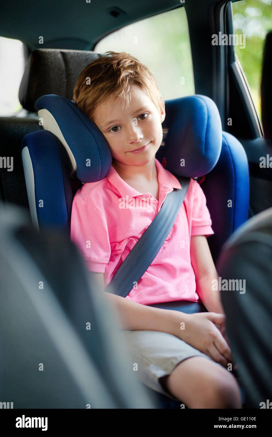 boy sits in a car seat Stock Photo - Alamy