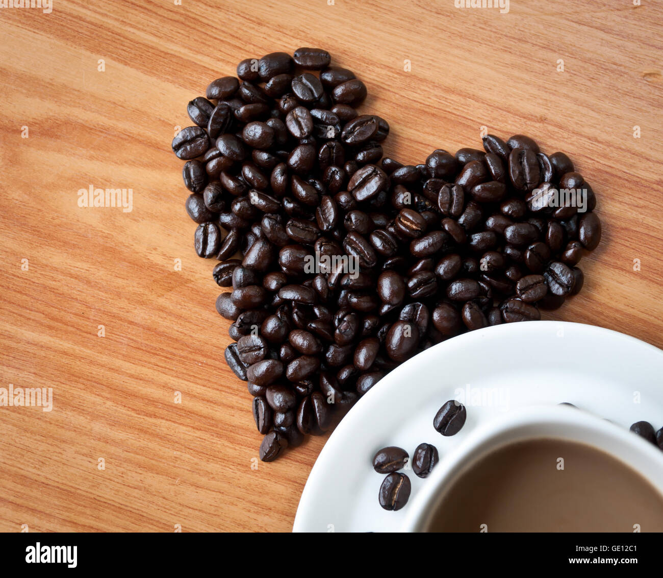 Concept of love with coffee beans on wood texture Stock Photo - Alamy