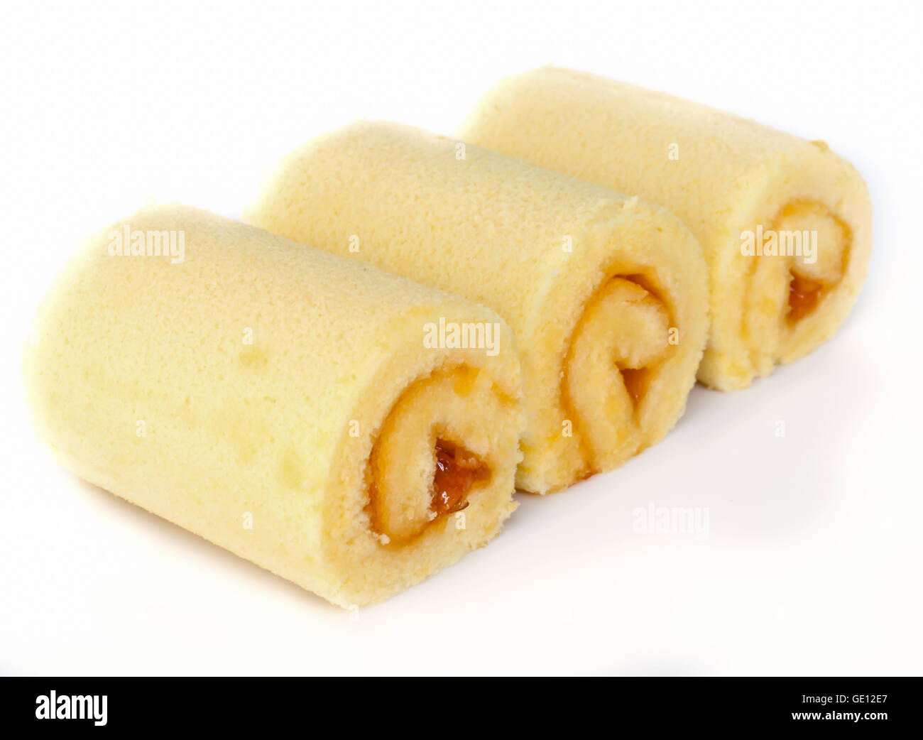 Sweet roll cake with orange jam isolated on white Stock Photo - Alamy
