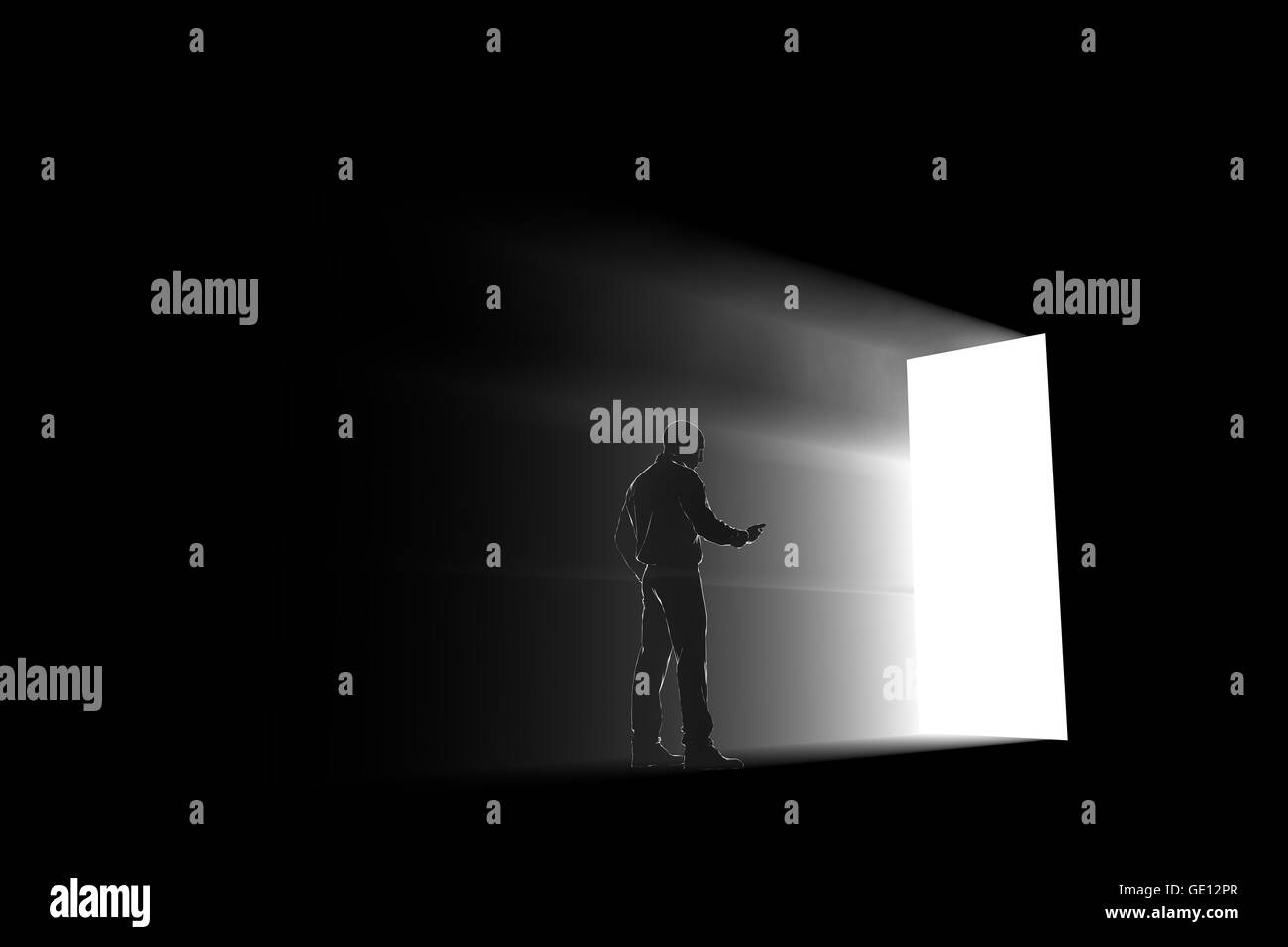 man silhouette exploring a portal light Stock Photo - Alamy