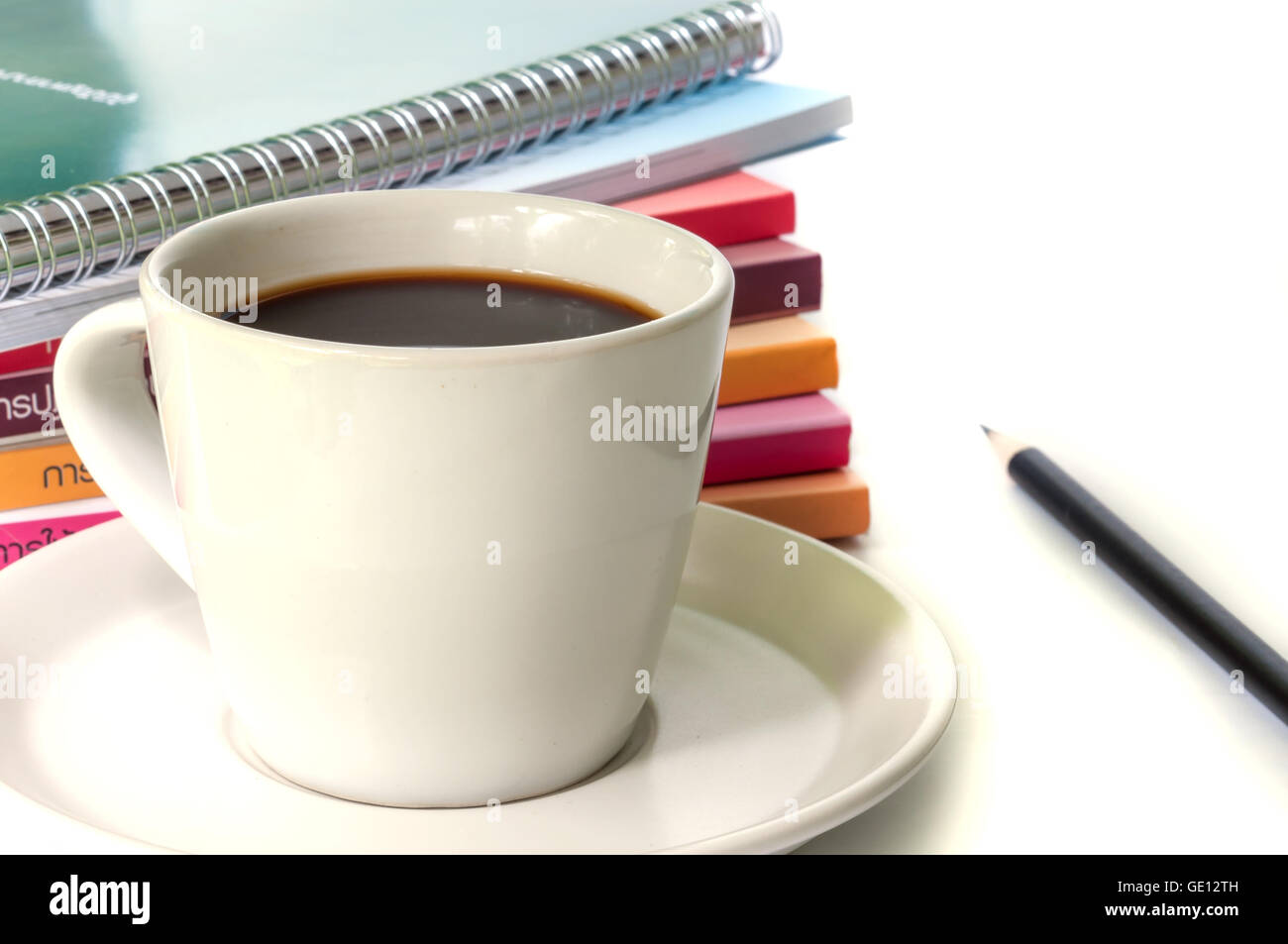 cup of coffee with pencil and notebook Stock Photo - Alamy
