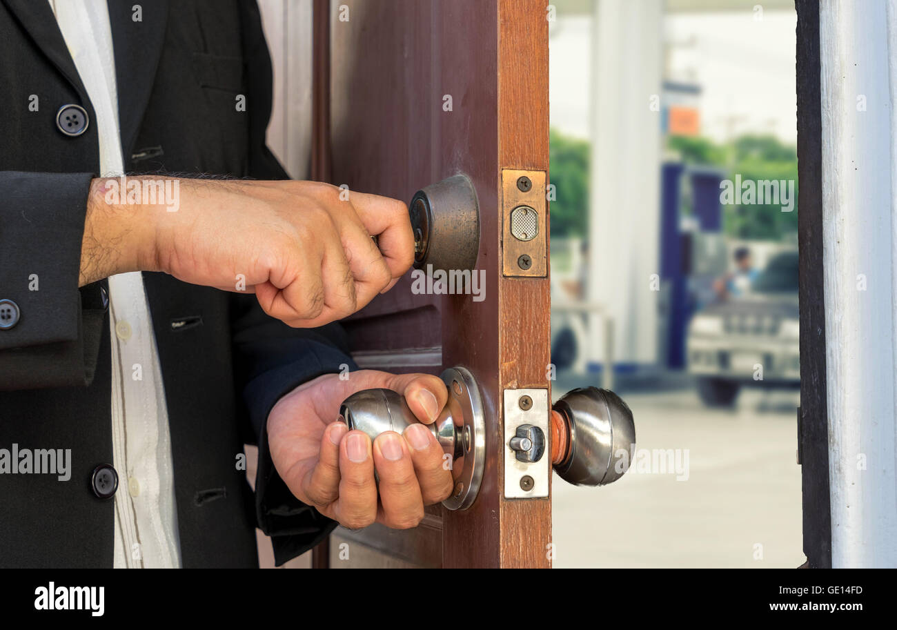 businessman open the door by key on blur gas station view - can use to ...
