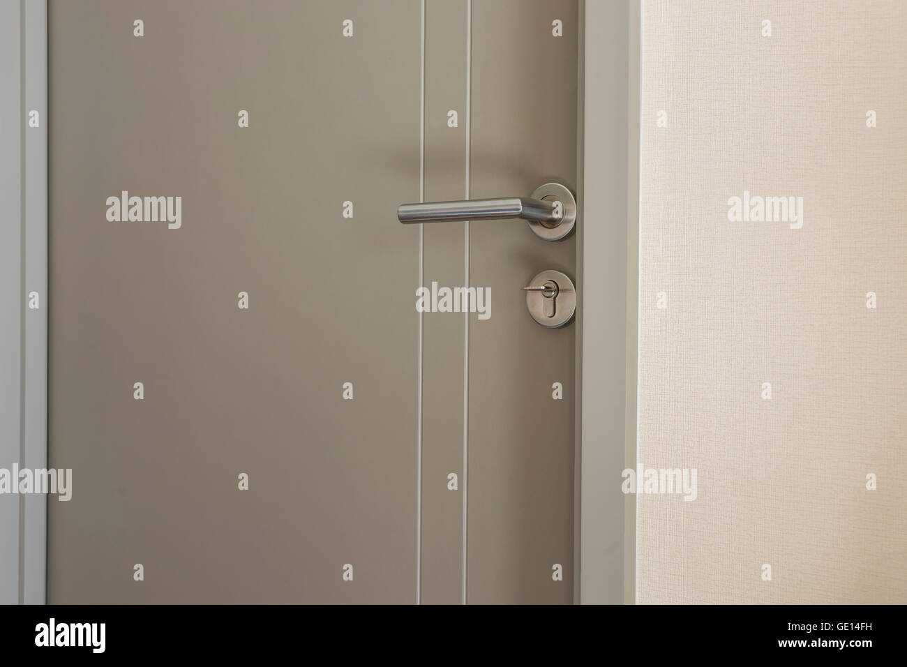 silver handle and gray door closed and wall room - can use to display ...