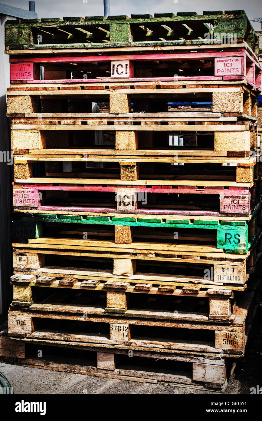 Stack of multicolored wooden pallets Stock Photo - Alamy