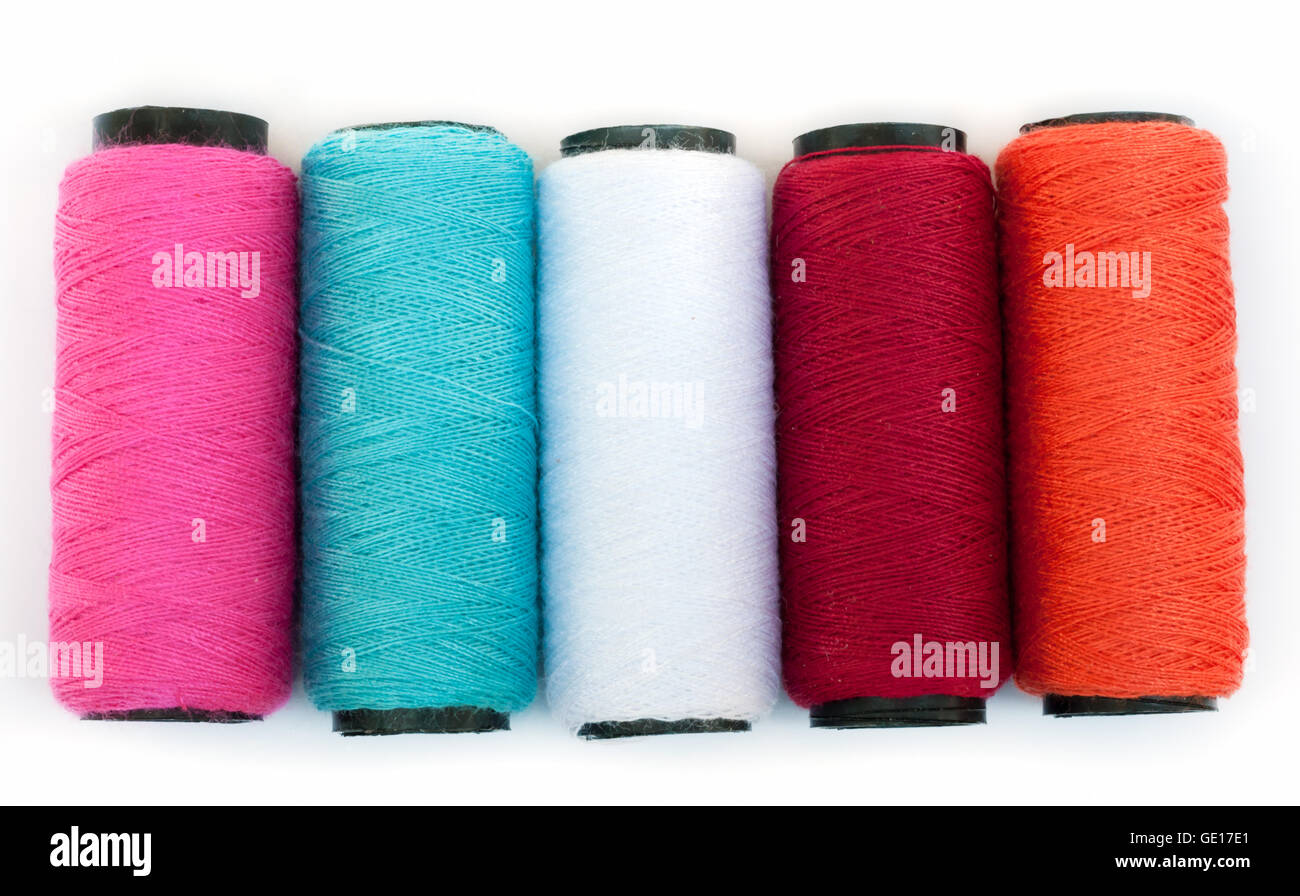 Spool of coloured thread isolated on white background Stock Photo - Alamy