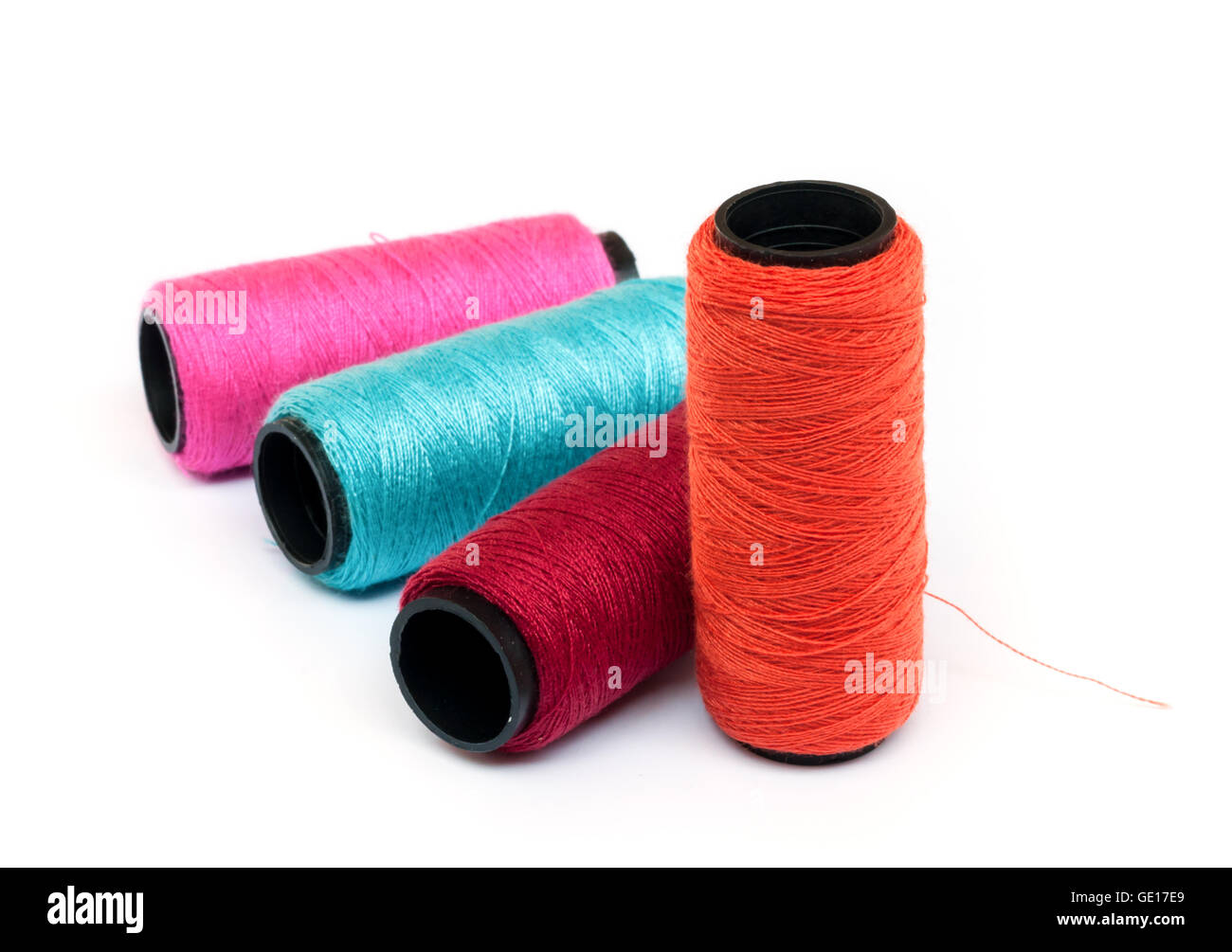 Spool of coloured thread isolated on white background Stock Photo - Alamy
