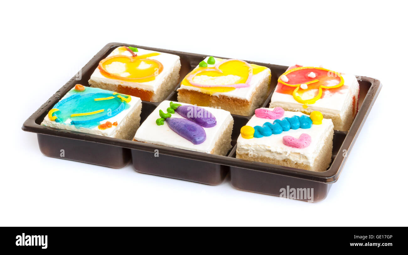 piece of fancy cakes on white background Stock Photo - Alamy