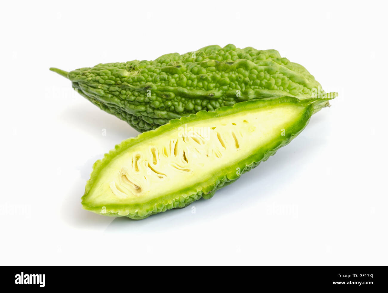 bitter gourd and slice on the white background Stock Photo - Alamy