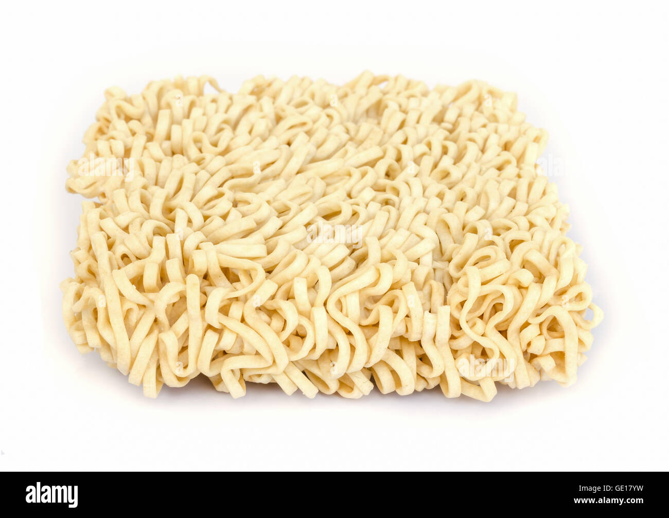 Uncooked noodles on white background Stock Photo - Alamy