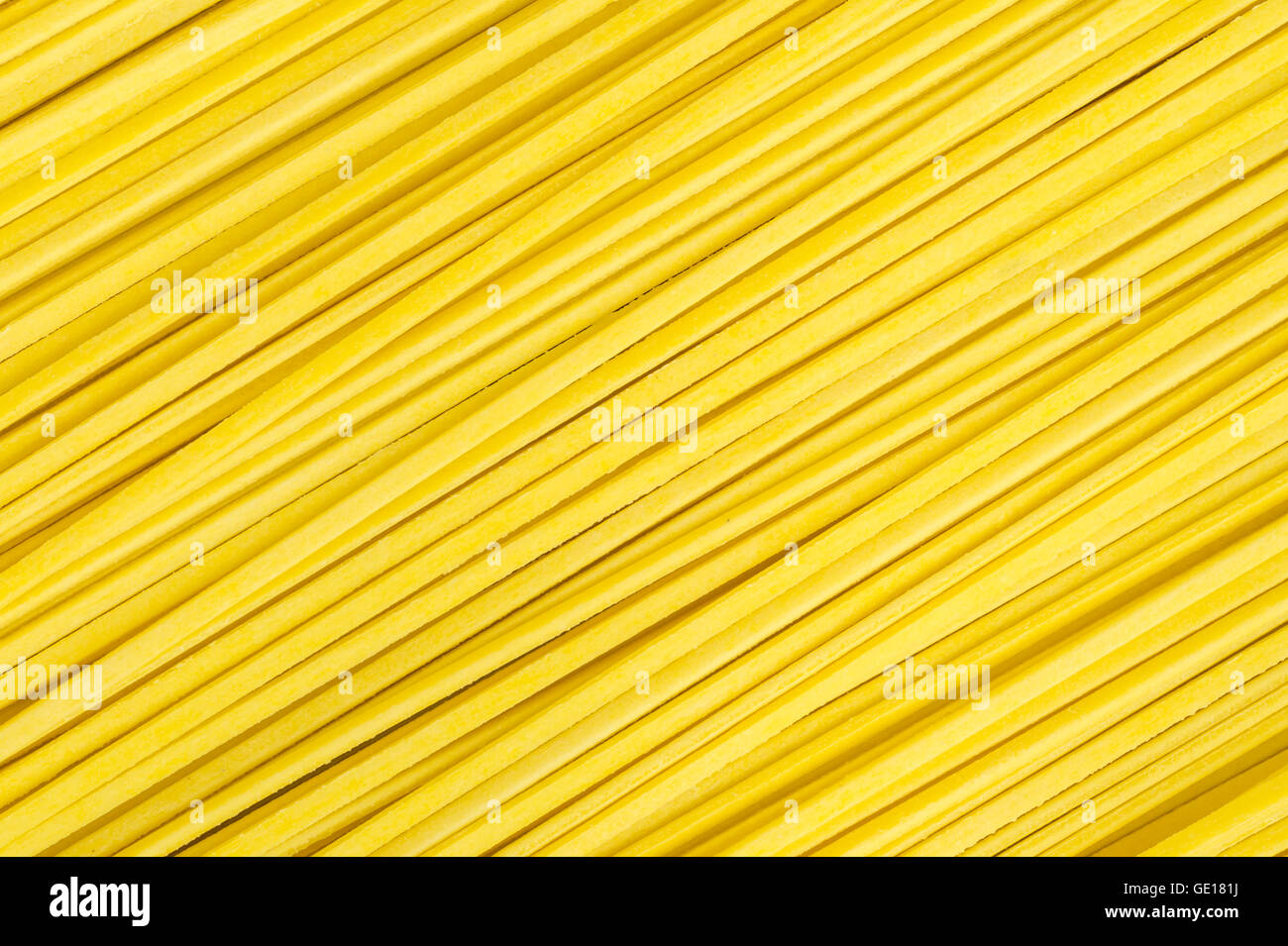 Background of uncooked italian spaghetti Noodles Stock Photo - Alamy