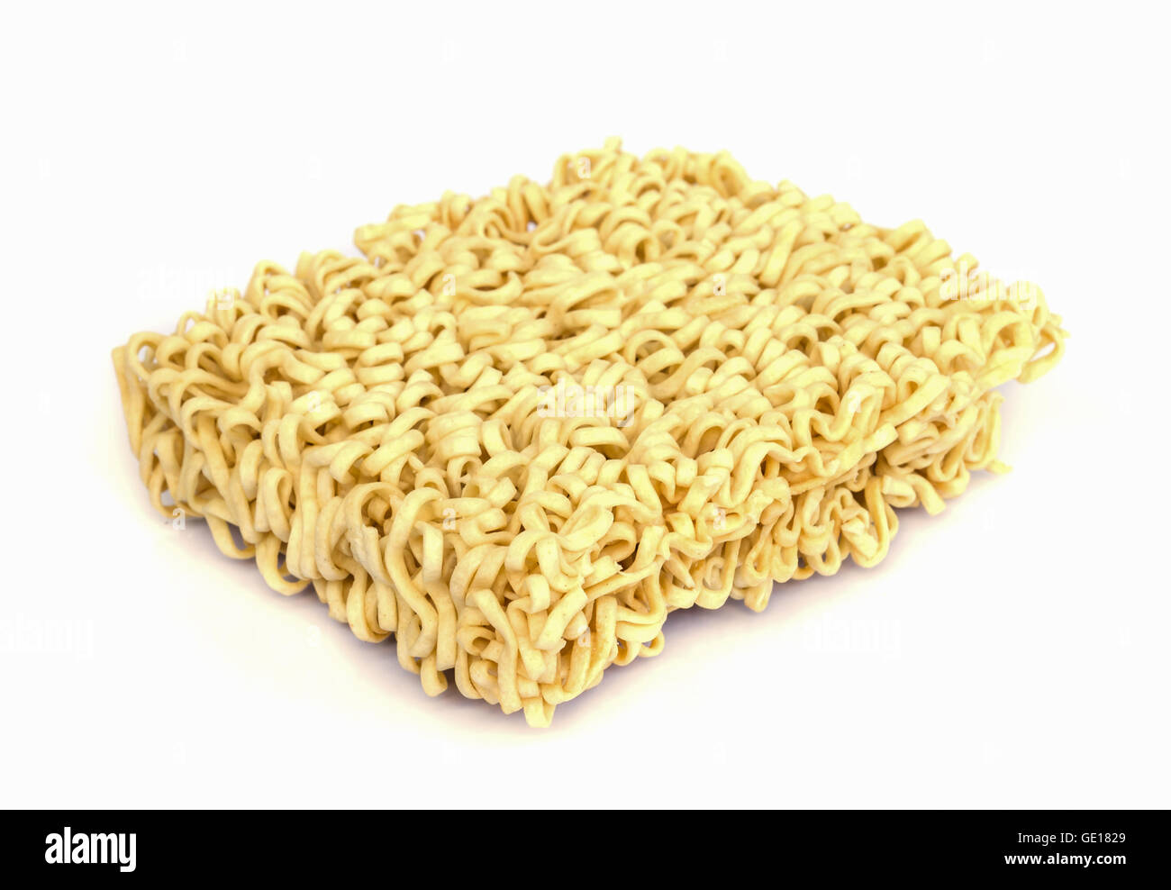 Uncooked noodles on white background Stock Photo - Alamy