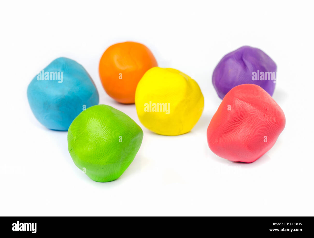 Ball of plasticine on white background Stock Photo - Alamy