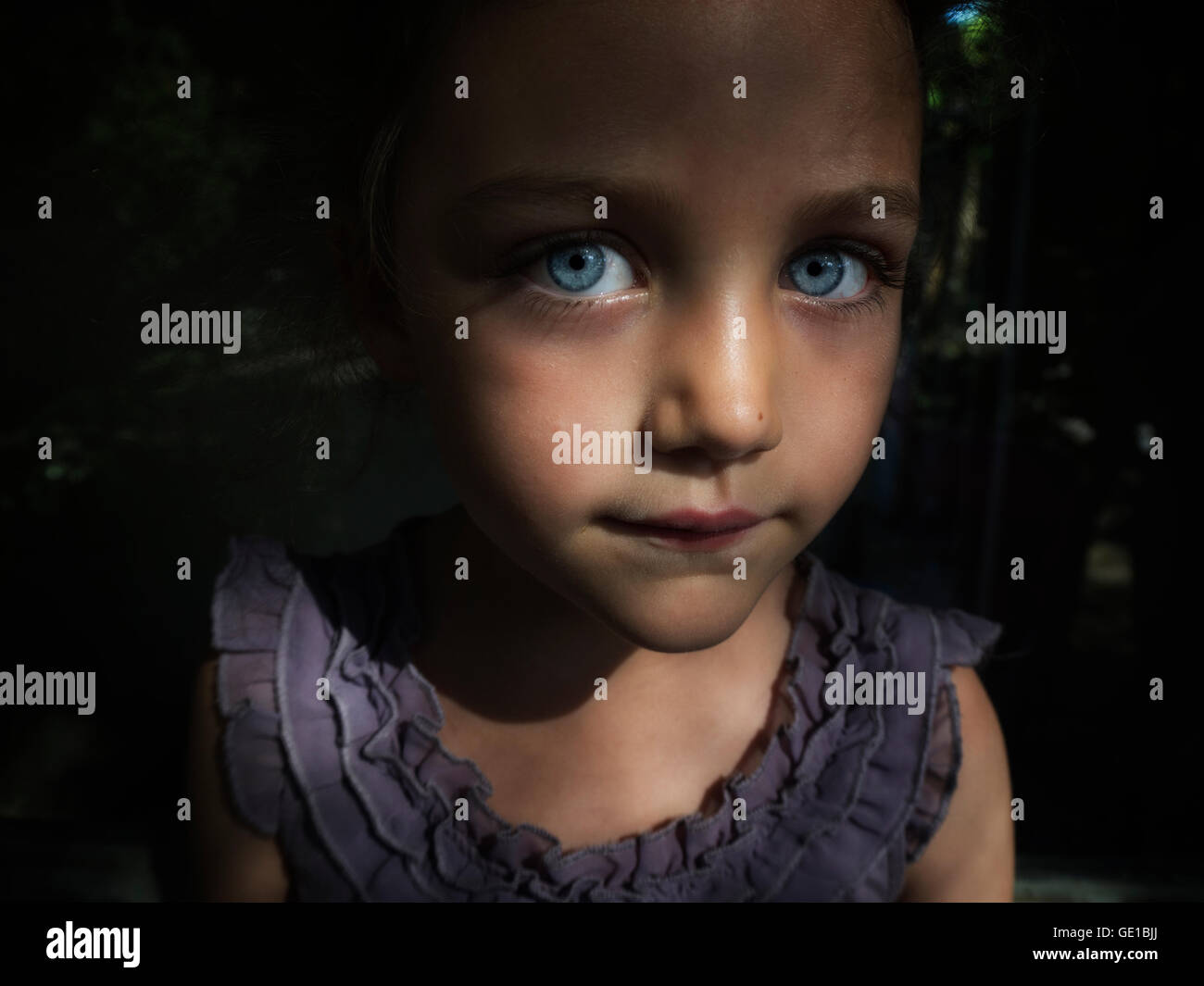 Portrait of a beautiful girl with piercing blue eyes Stock Photo - Alamy
