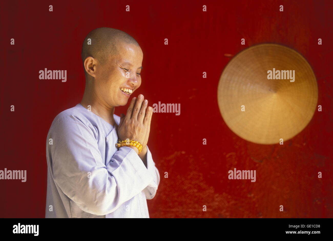 a women monk in a chinese temple in the city of Can Tho in the mekong ...