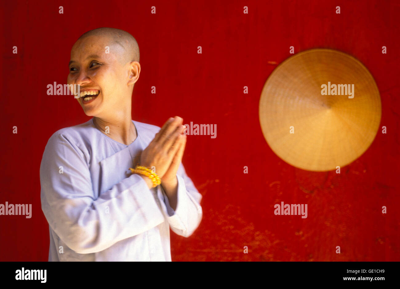 a women monk in a chinese temple in the city of Can Tho in the mekong ...