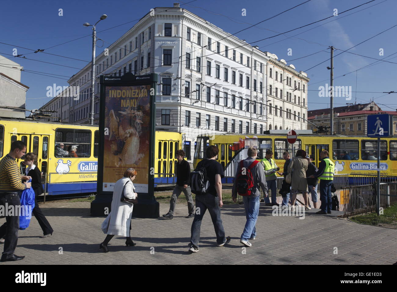 a city train in a street in the old town in the city of riga in latvia ...