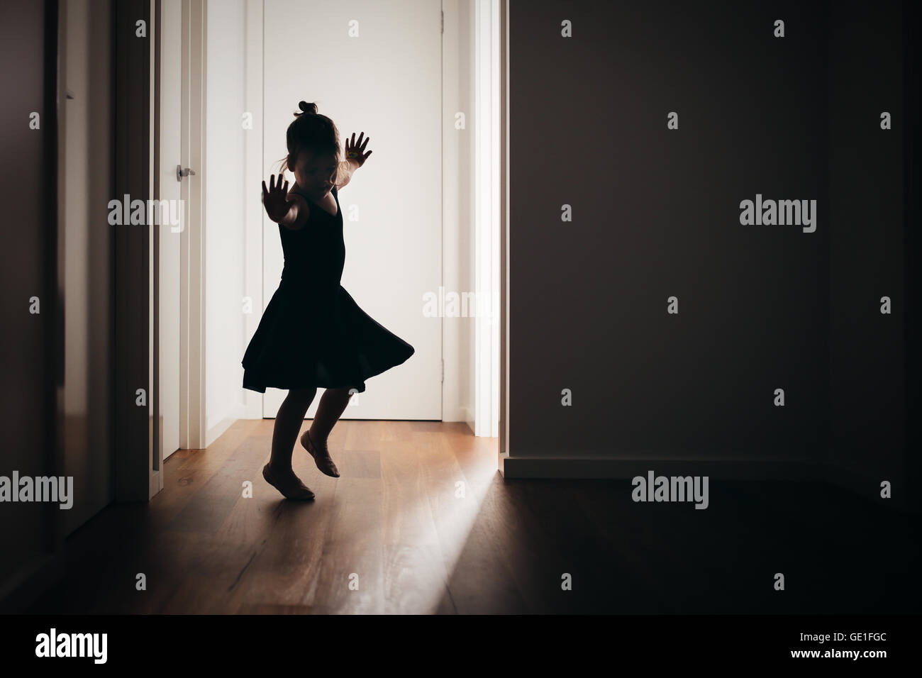 Silhouette of a girl dancing in the hallway Stock Photo - Alamy