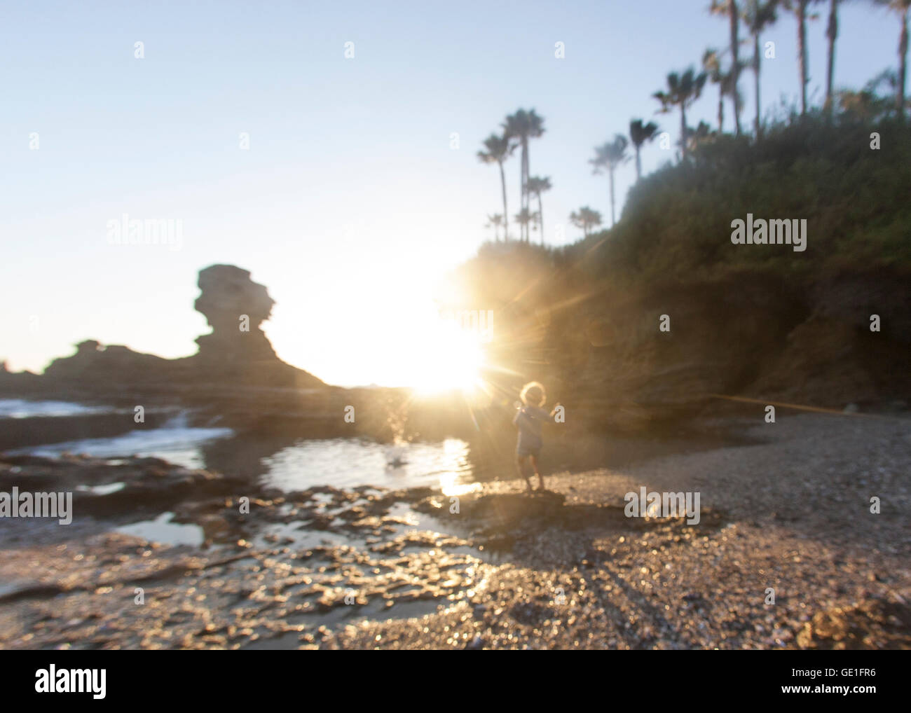 Boy at beach sunset hi-res stock photography and images - Alamy
