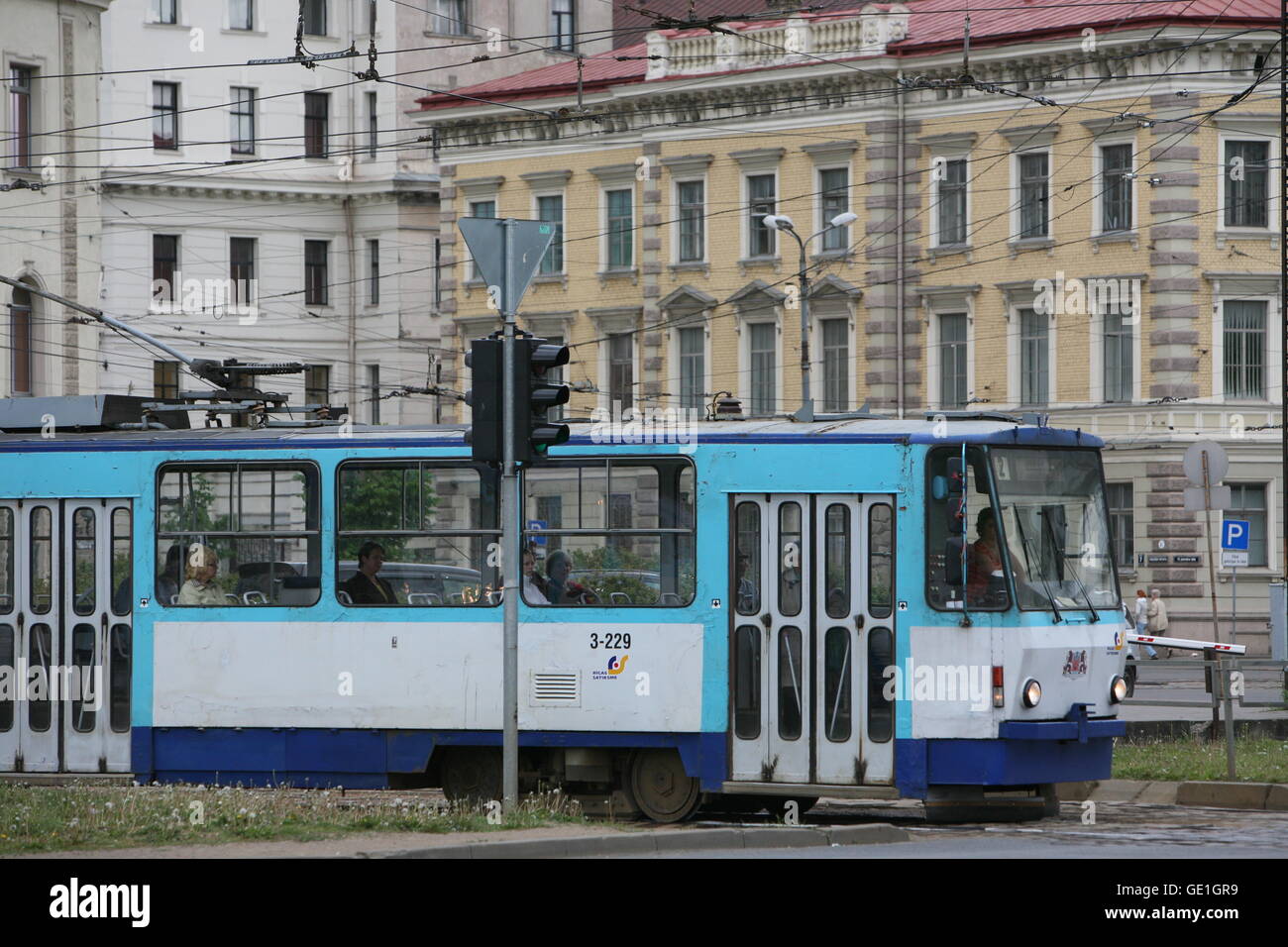 a city train in a street in the old town in the city of riga in latvia ...