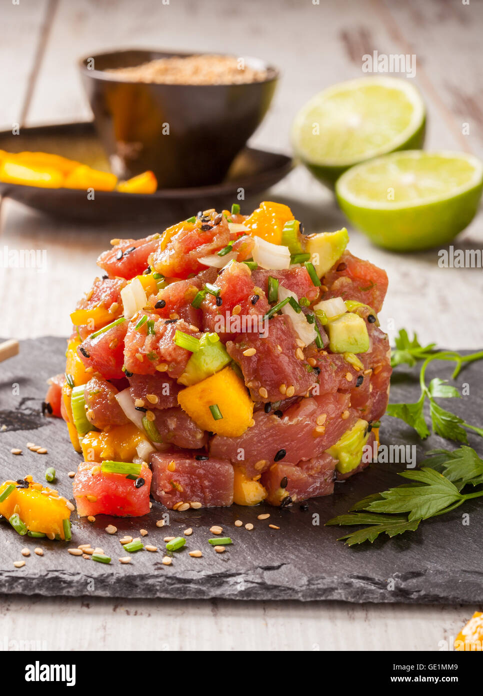 Hawaiian tuna poke with mango, avocado, onion and sesame seeds Stock ...