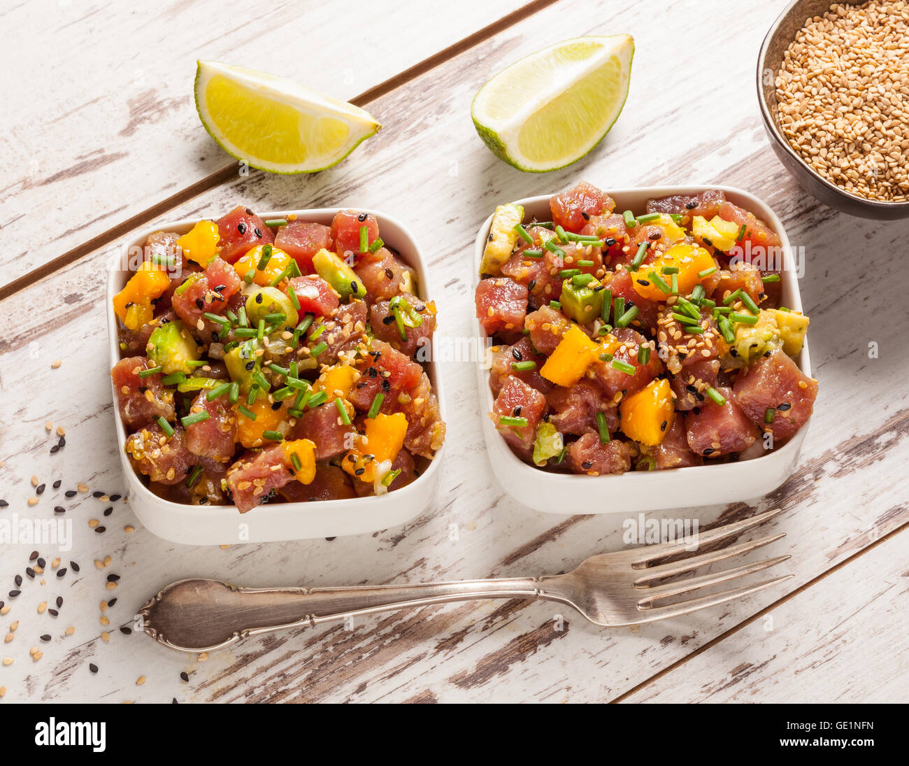 Hawaiian tuna poke with mango, avocado, onion and sesame seeds Stock ...