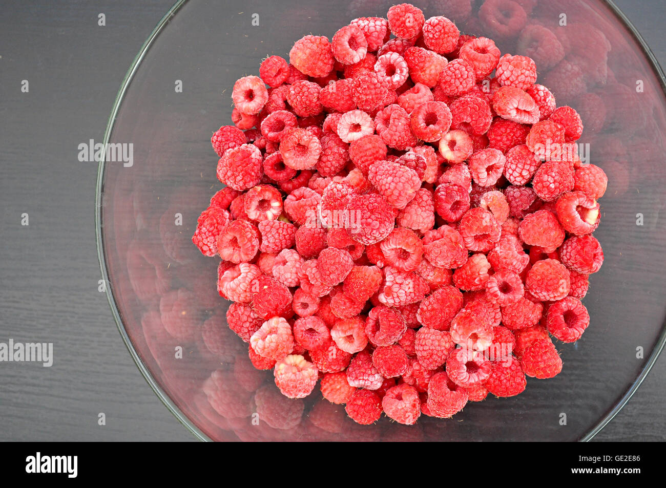 Juicy frozen raspberries in glass hi-res stock photography and images ...