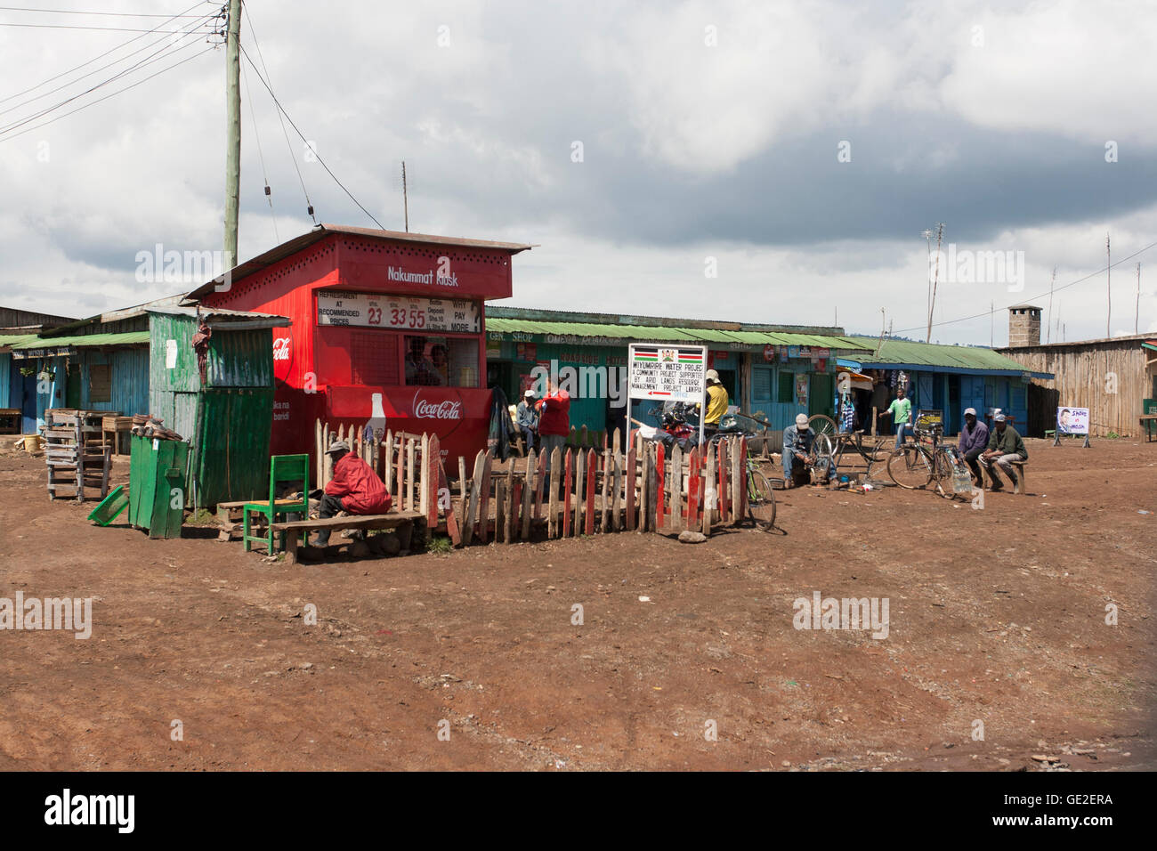 A typical market place scene with vegetable vendors hair salons laundry ...