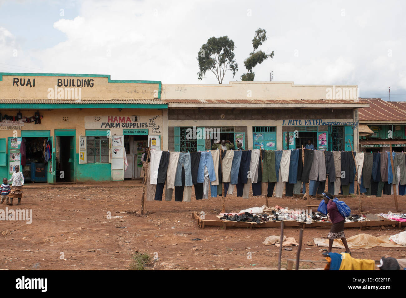 A typical market place scene with vegetable vendors hair salons laundry ...